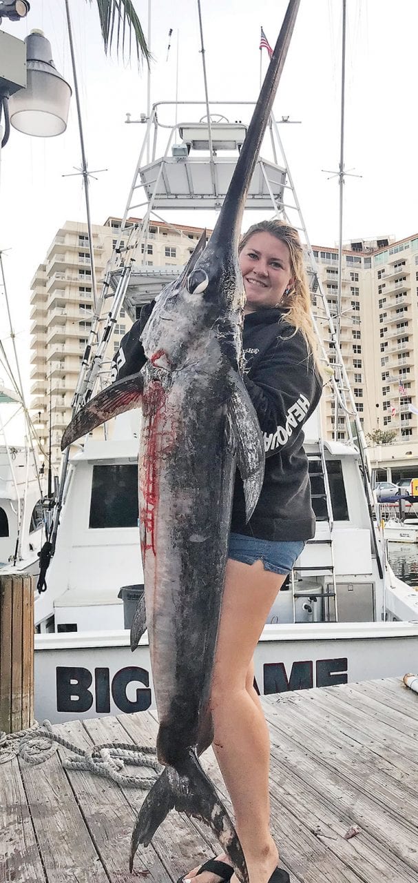 Ashley with her big swordfish - Coastal Angler & The Angler Magazine