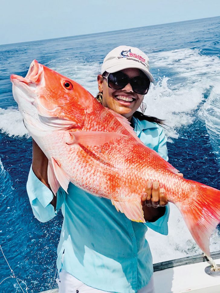 Claudia Patrizio shows off her first red snapper ever, caught recently ...