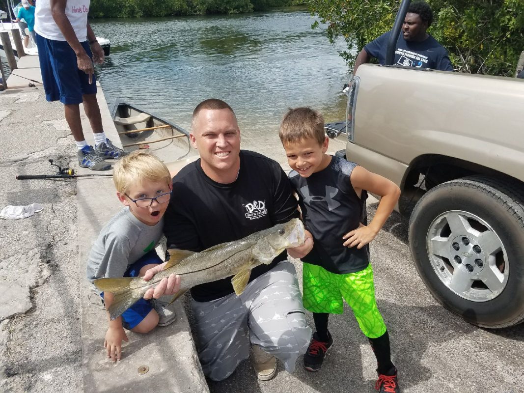 L to R-Brody & Douglas Root, Logan Hawkins w/ a released snook at D & D ...