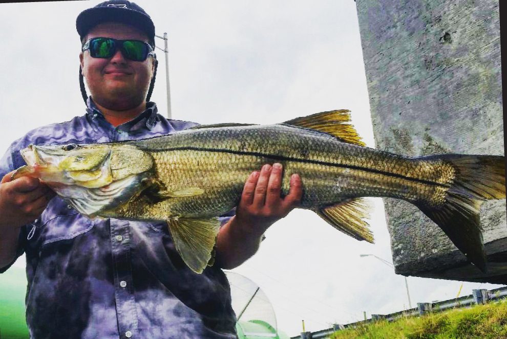 Logan Wright with a Mogan Snook - Coastal Angler & The Angler Magazine