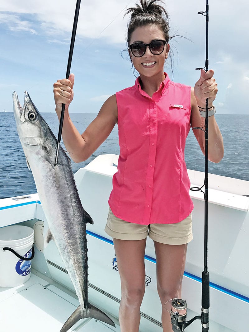 Lady angler with a solid kingfish caught with Nomad Fishing Charters ...