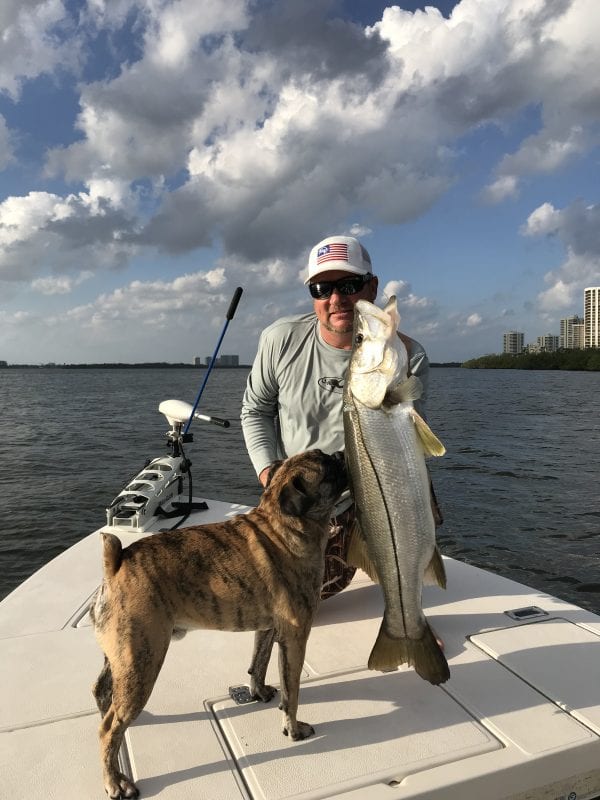 Captain Trey Giraitis and his dog Tank with a nice 32 inch snook Singer ...