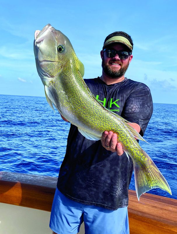 Brandon Day with a golden tilefish caught bottom fishing off the ...