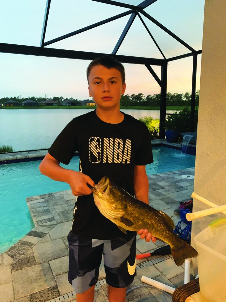Mason Shaffner, 12yo, proudly holds a nice largemouth bass caught in ...