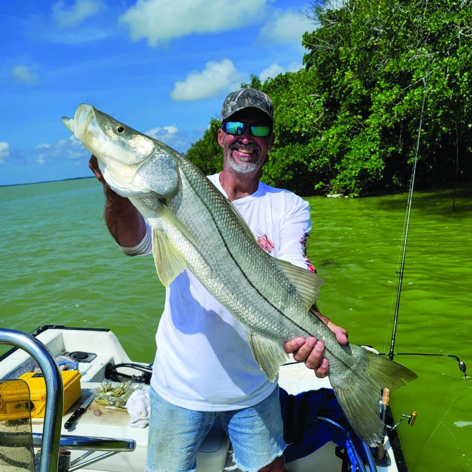 Dean Daniel w a 32″ slot. - Coastal Angler & The Angler Magazine