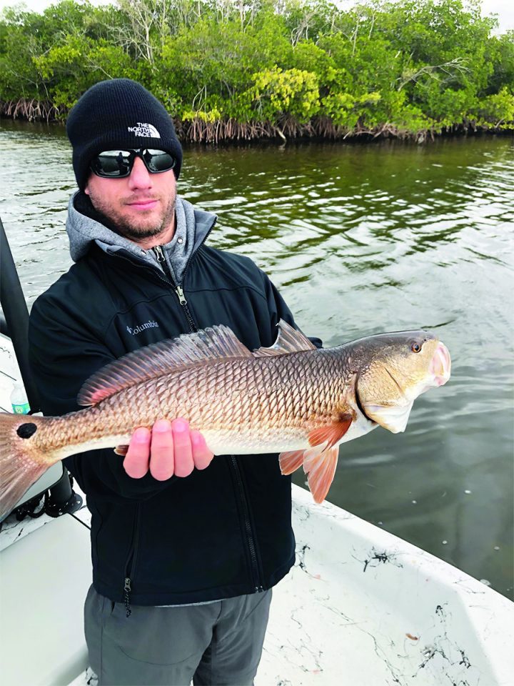 Evan Feldman with a nice redfish he caught on a chilly trip to New Port ...