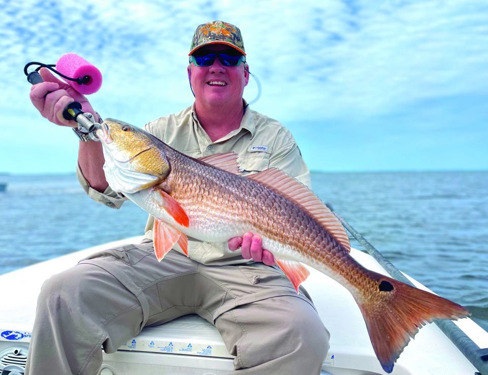 Brian O’Dea w/ a 9 lb. red on a gold spoon near Jug Creek. - Coastal Angler & The Angler Magazine