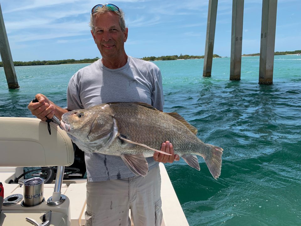 Jim Partyka w/ a big black drum caught by New Pass Bridge. - Coastal ...