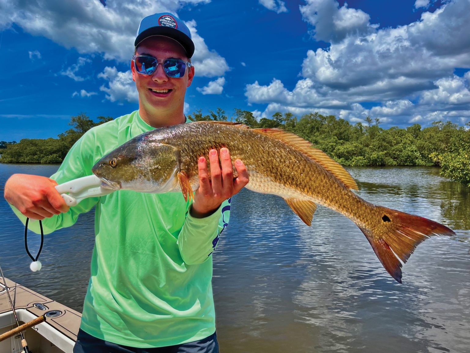 Connor w/ an over slot redfish caught in the backcountry of Naples on a ...