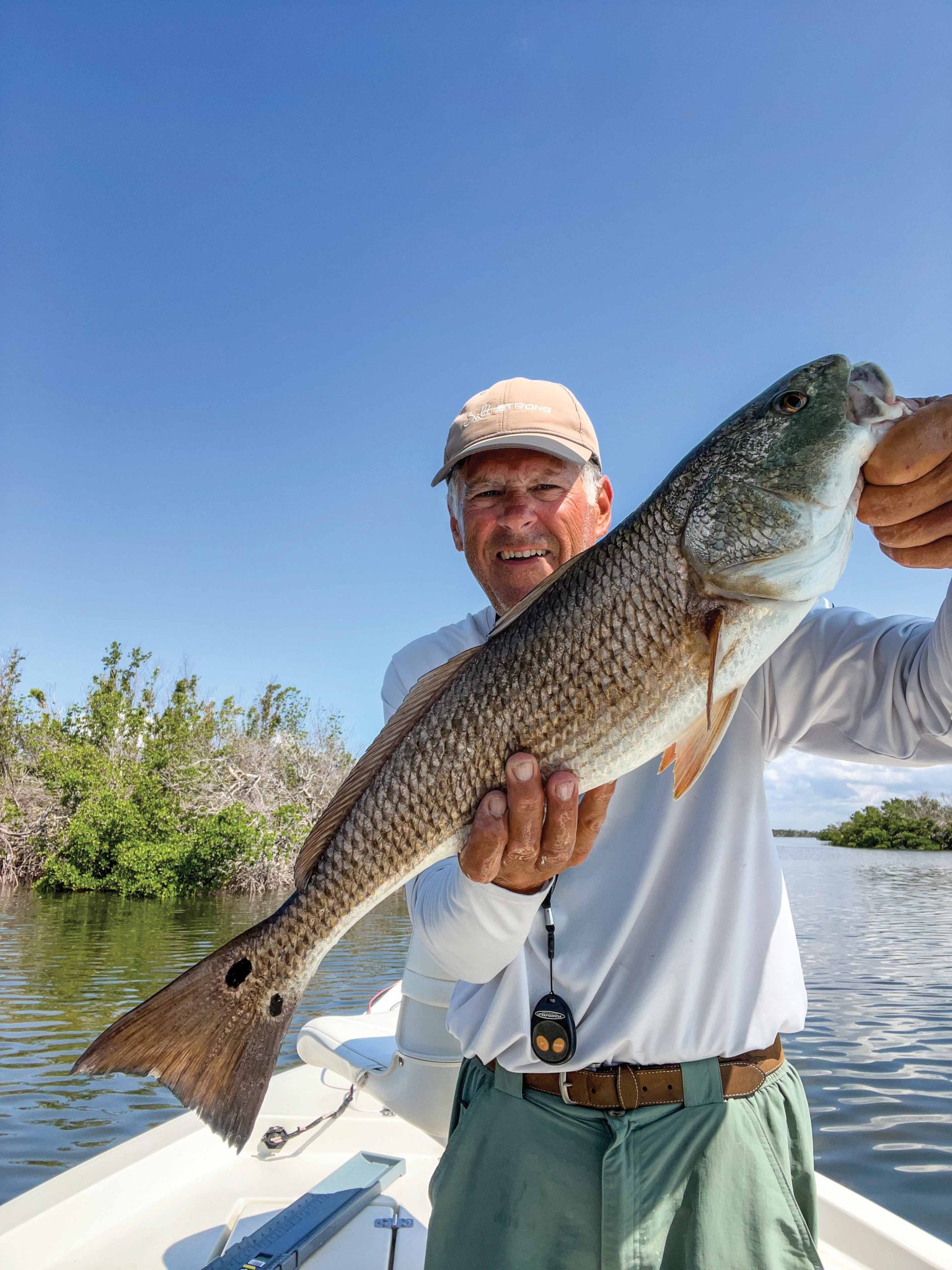 Capt. Tom Marks with a 28 inch redfish caught near Placida Fl ...