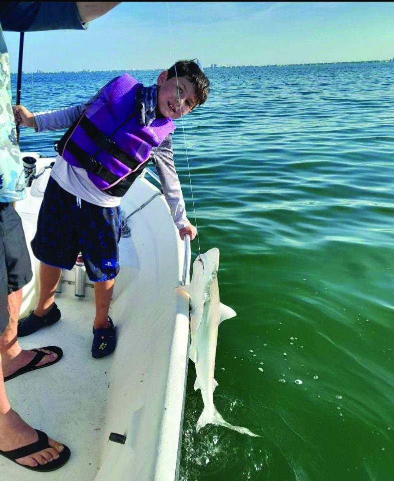 Mason S. building muscles playing with lemon sharks! - Coastal Angler ...