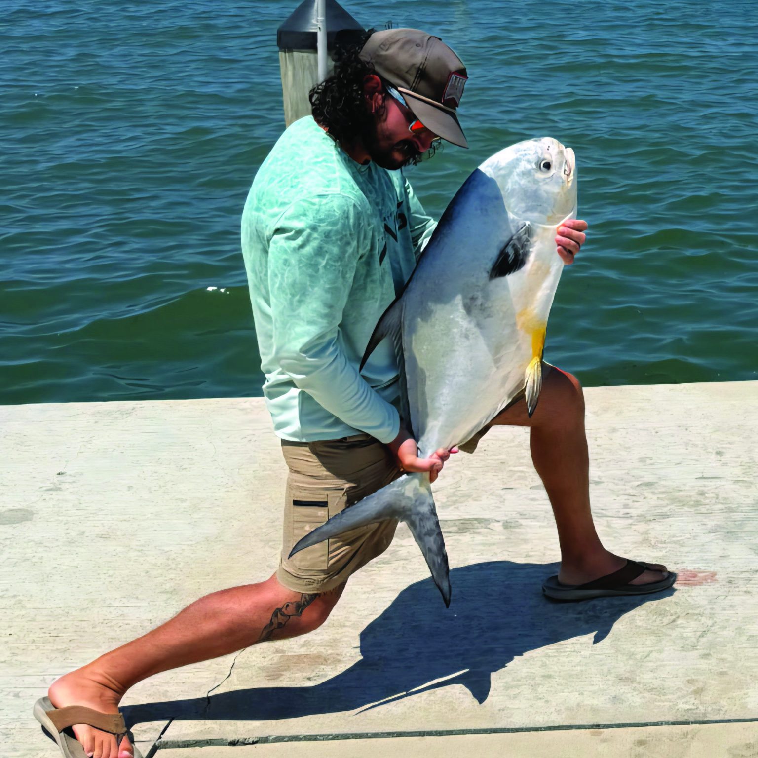 Jacob Long with a beautiful permit caught just offshore in Manasota Key ...